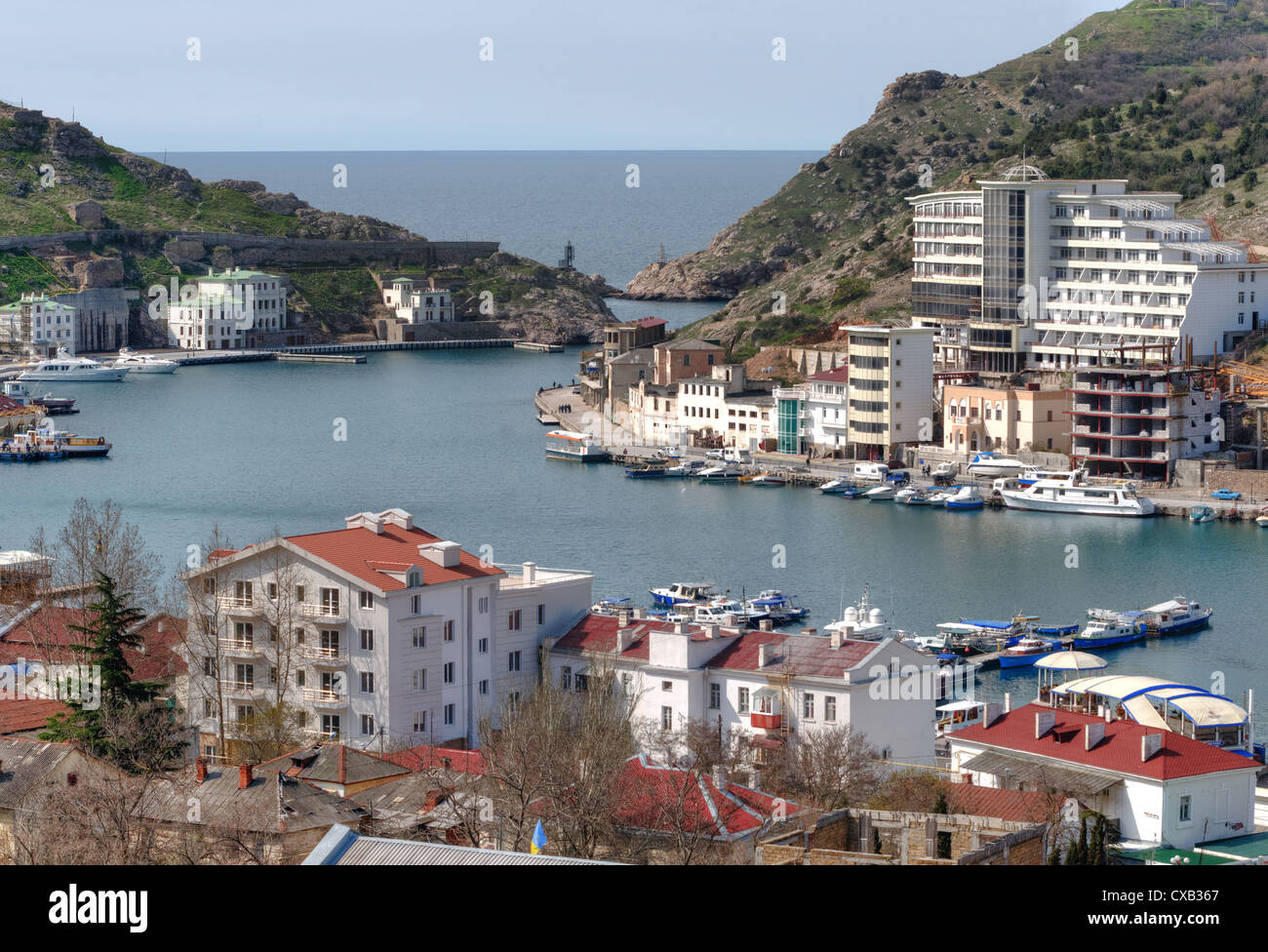 seafront with ships at pier Balaclava Town, Crimea, Ukraine Stock Photo ...