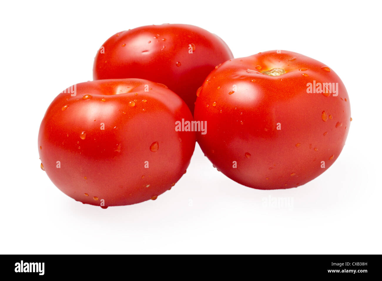 three red tomatoes isolated on white background Stock Photo - Alamy