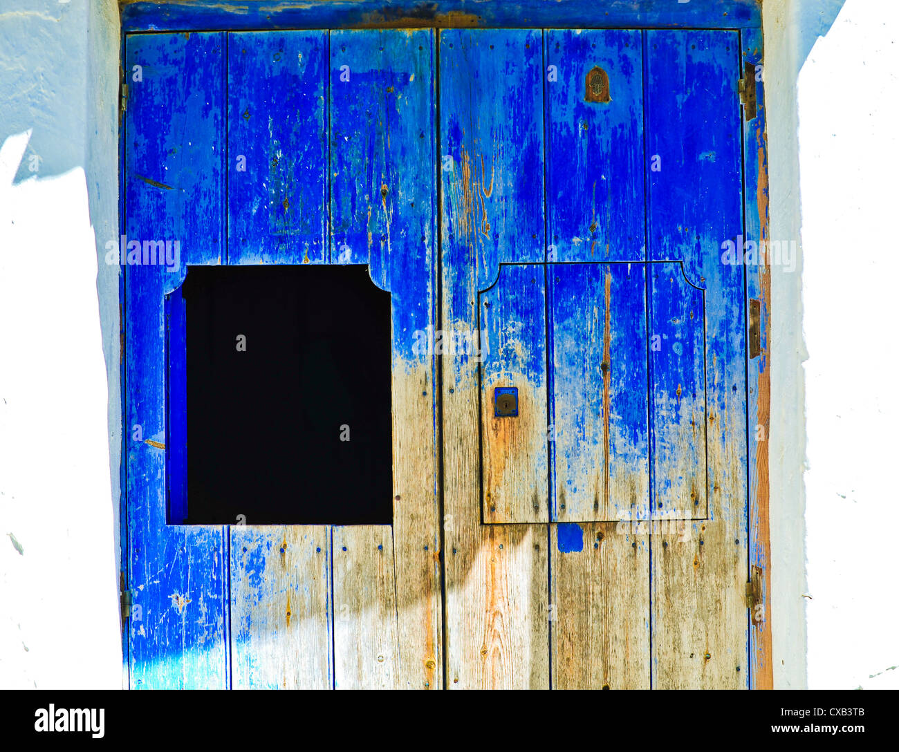 Old blue doors in hot sun of southern Spain Stock Photo - Alamy