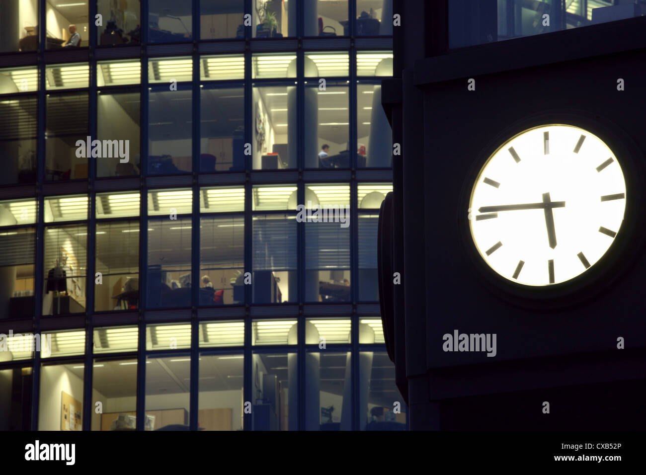 Radiant Clock and office building Stock Photo - Alamy
