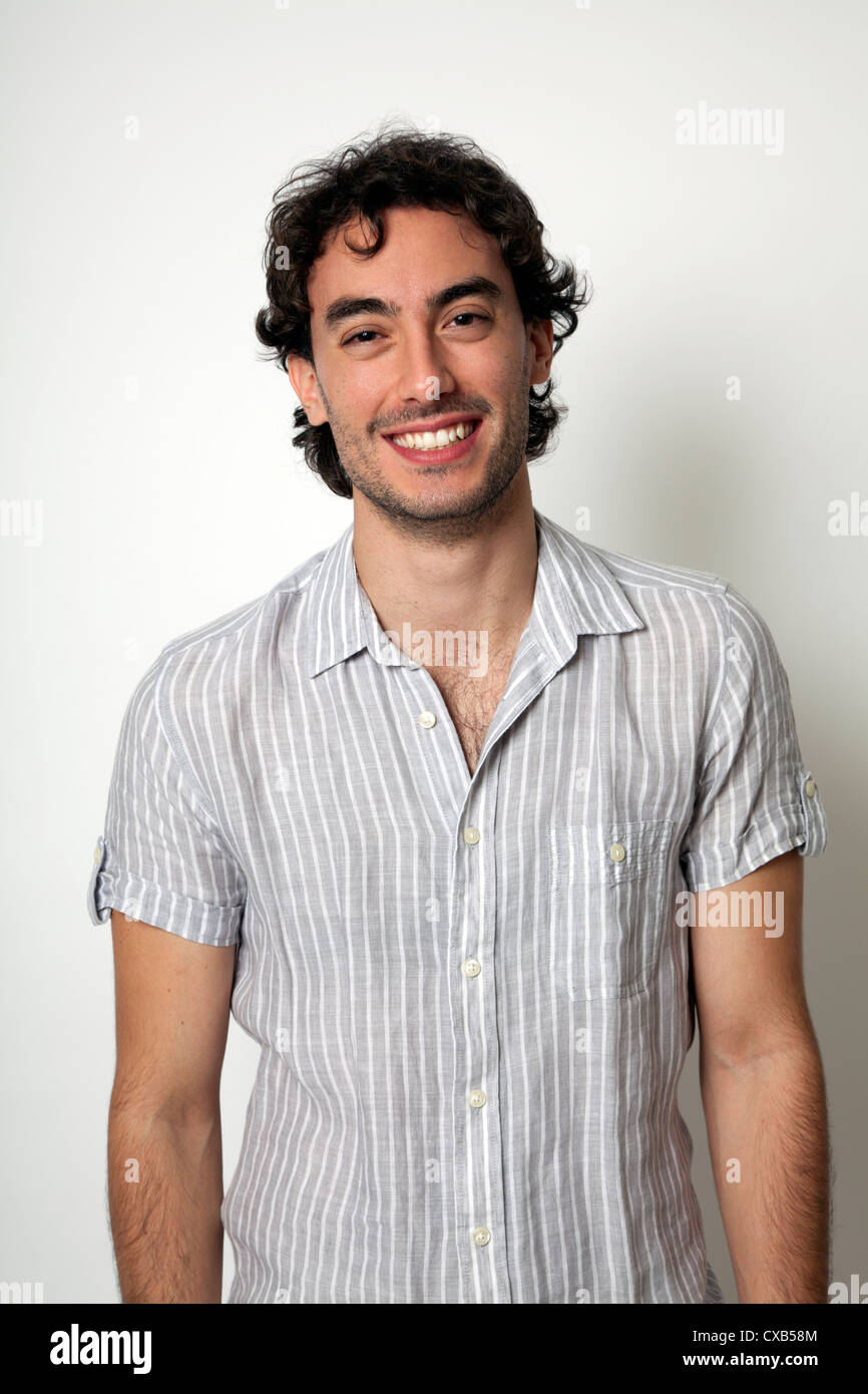 Casual Guy in Studio with Smiling Expression Stock Photo - Alamy
