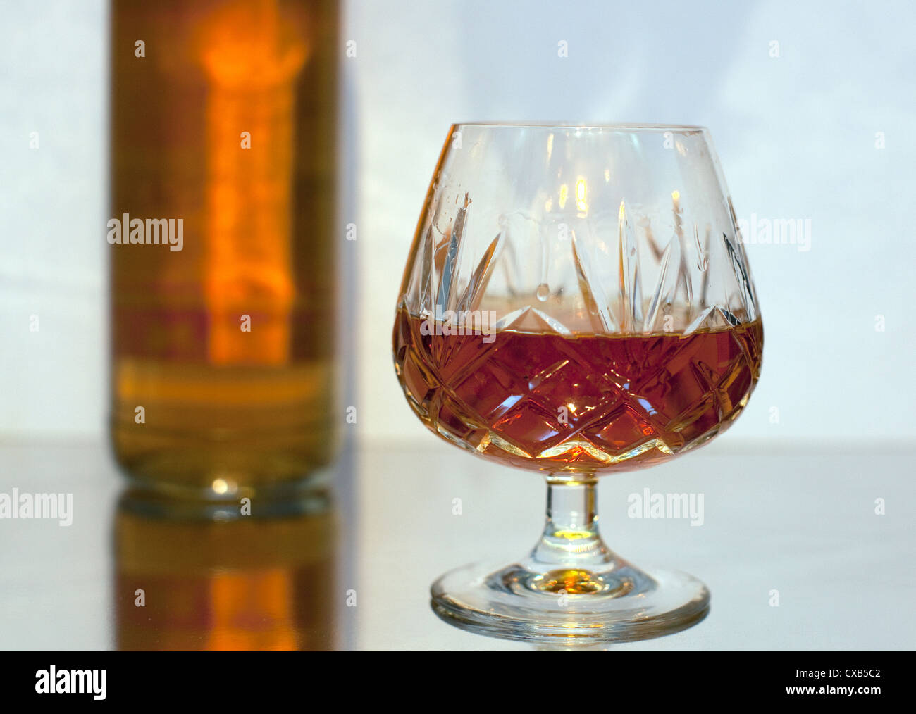 Glass and bottle of brandy, London Stock Photo - Alamy