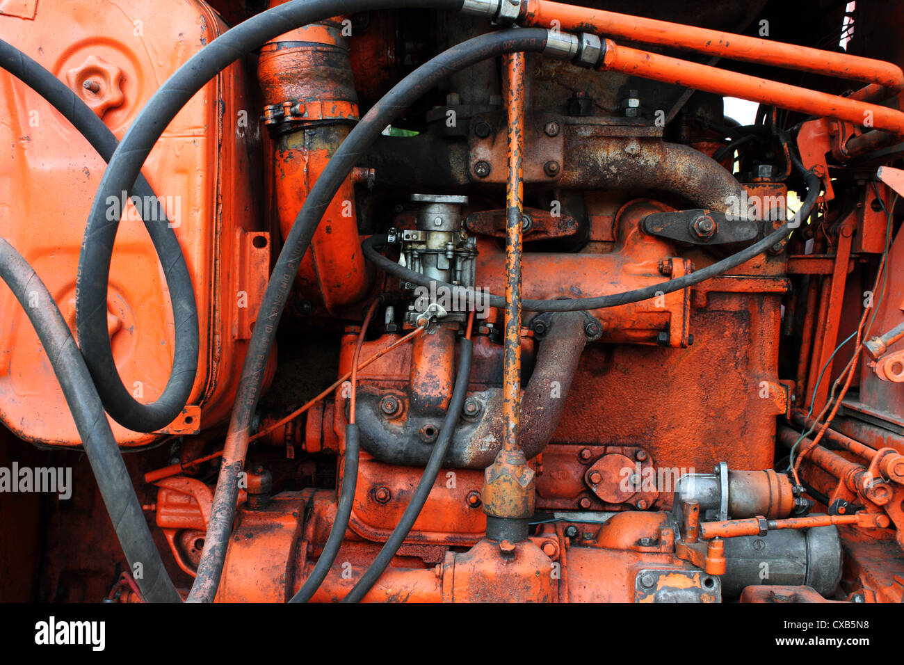 orange tractor engine Stock Photo - Alamy