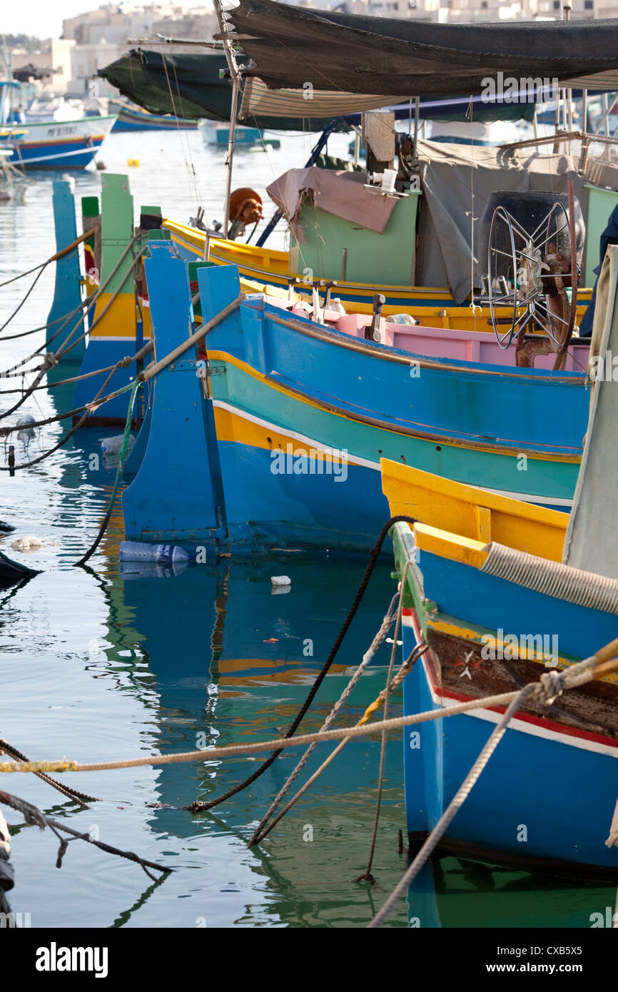 Colourful traditional luzzu fishing boats Marsaxlokk harbour Malta ...