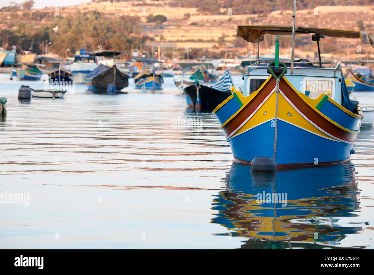 Colourful traditional luzzu fishing boats Marsaxlokk harbour Malta ...