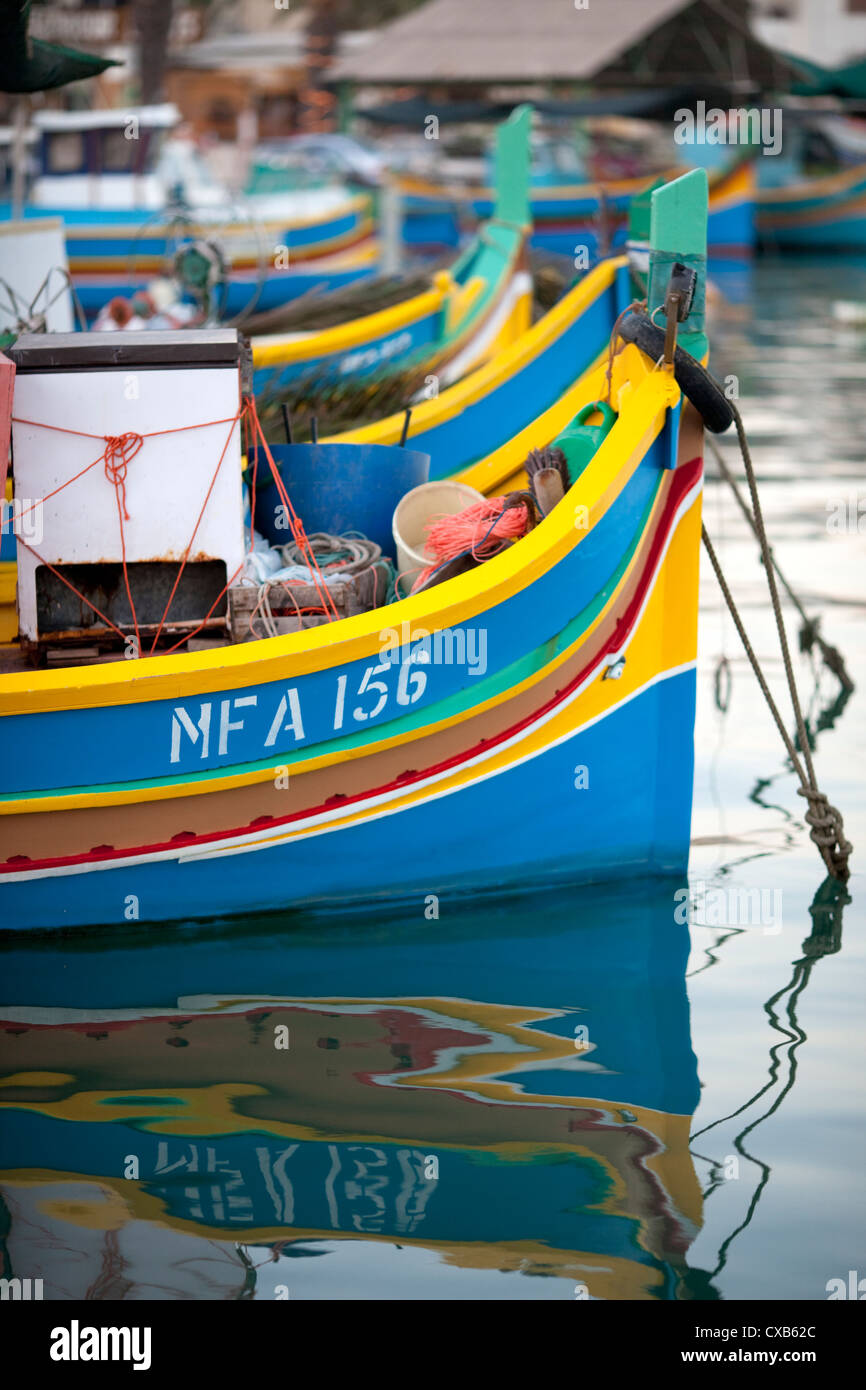 Colourful traditional luzzu fishing boats Marsaxlokk harbour Malta ...