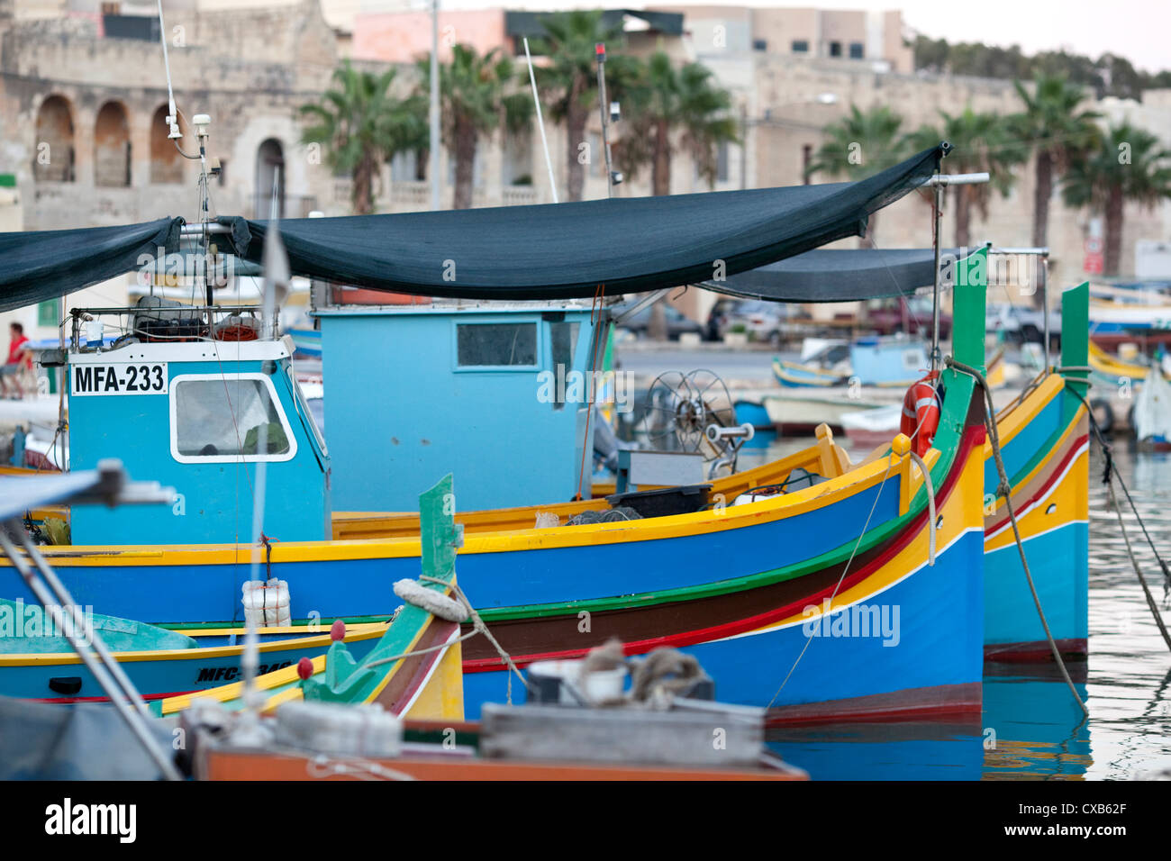 Colourful traditional luzzu fishing boats Marsaxlokk harbour Malta ...