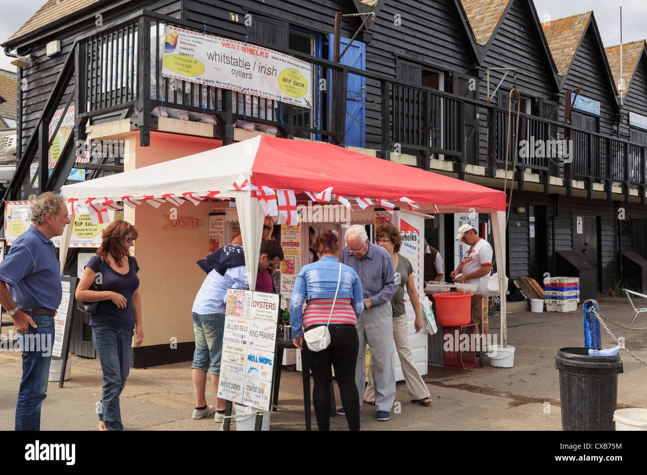 Seafood stall selling cooked Oysters and shellfish outside traditional ...