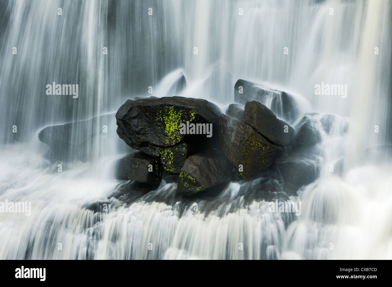 Water running over piled rocks at Ebor Falls Stock Photo - Alamy