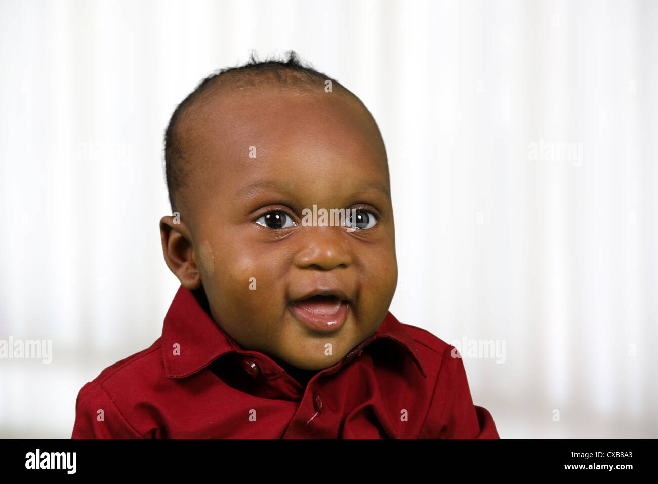 Portrait of a boy who is inside his home Stock Photo - Alamy
