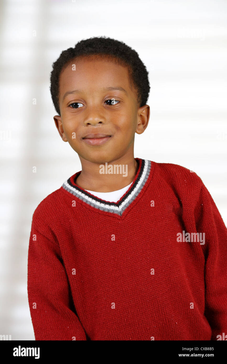 Portrait of a boy who is inside his home Stock Photo - Alamy