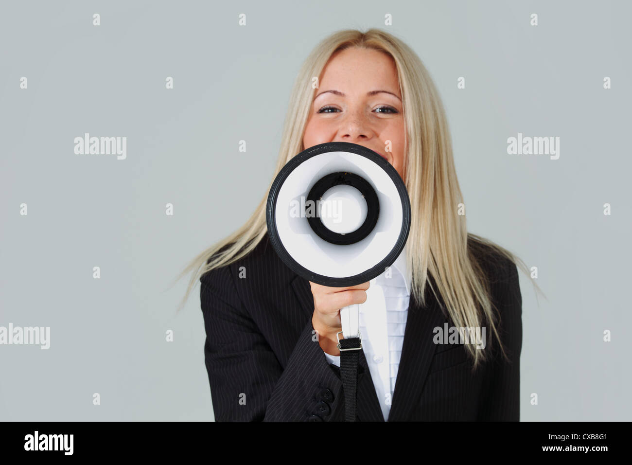 businesswoman with megaphone studio isolated Stock Photo - Alamy