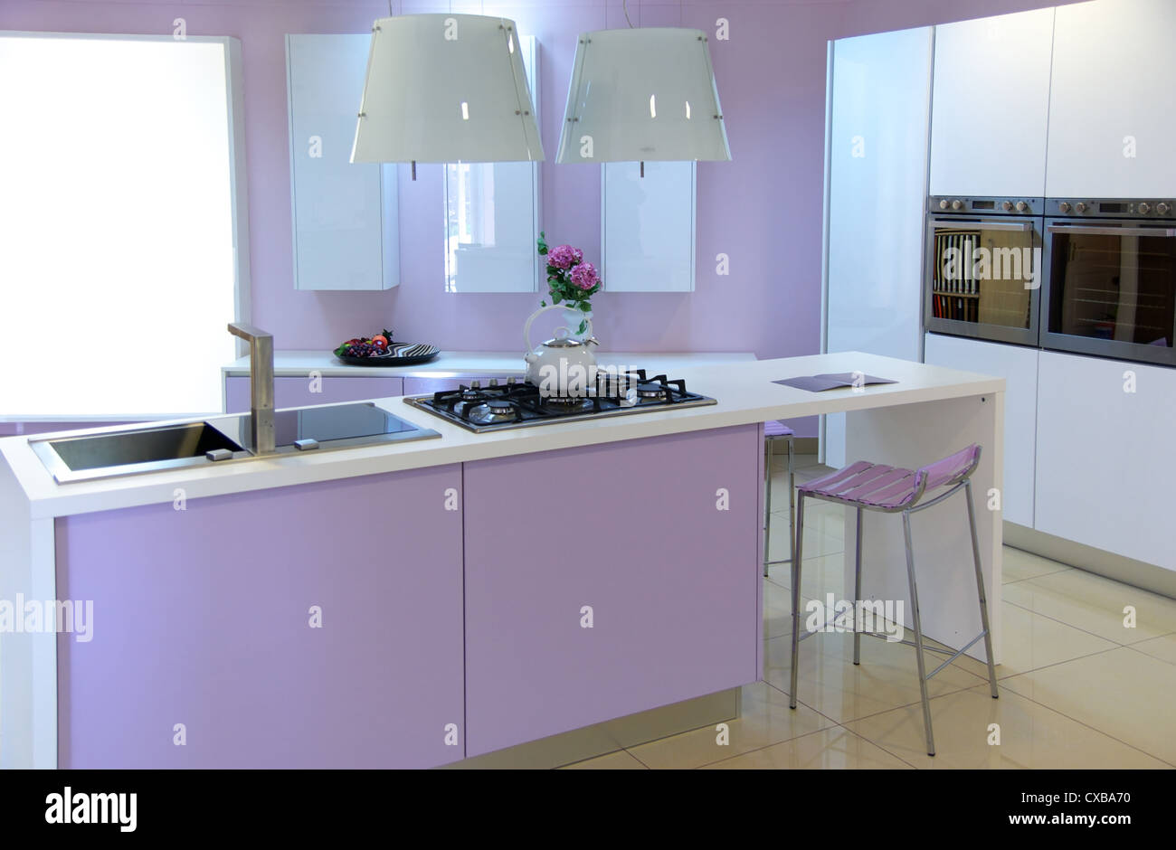 Modern pink kitchen. Indoor design Stock Photo - Alamy