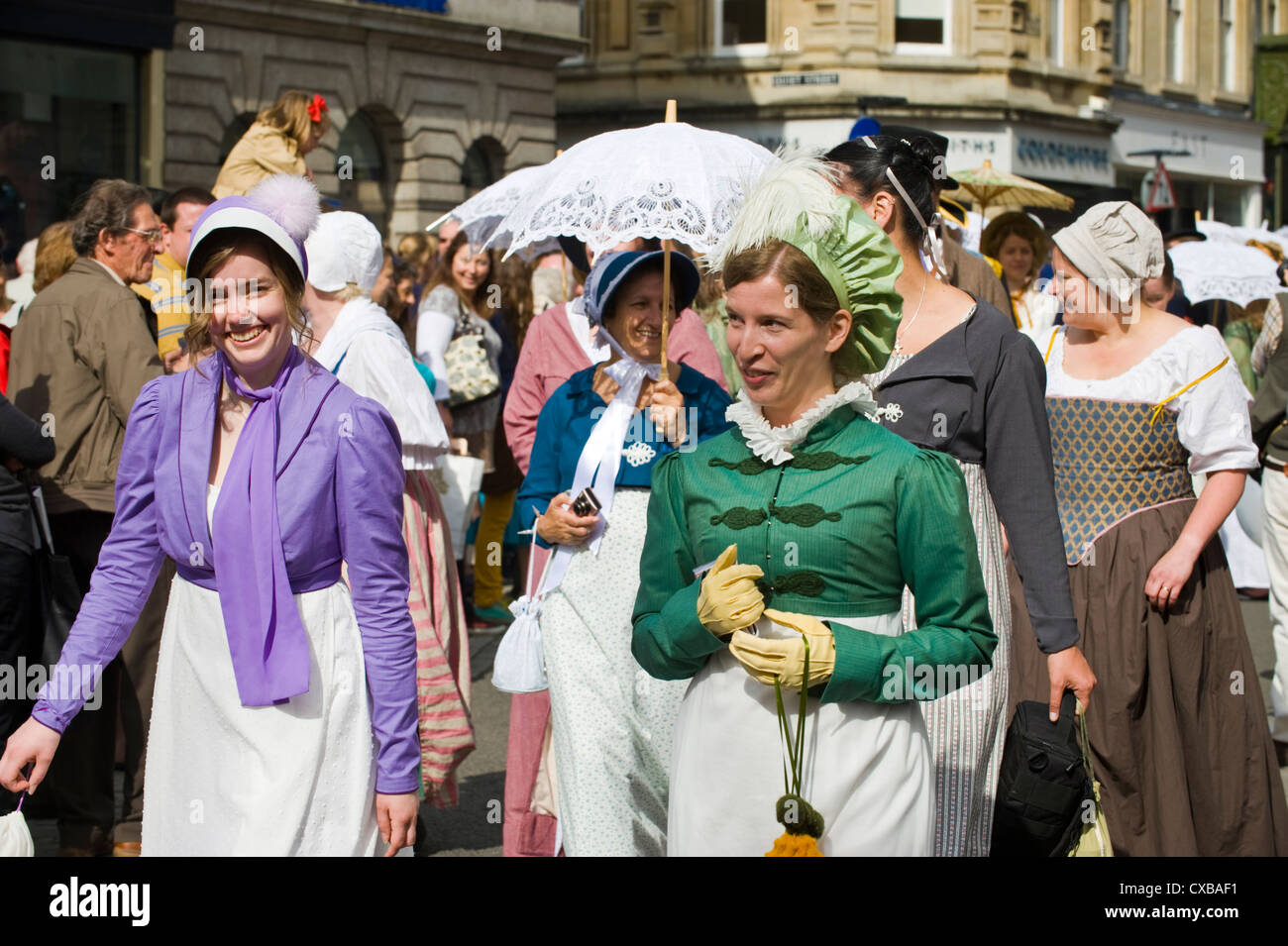 Ladies in Regency costume promenade through Bath city centre during the ...