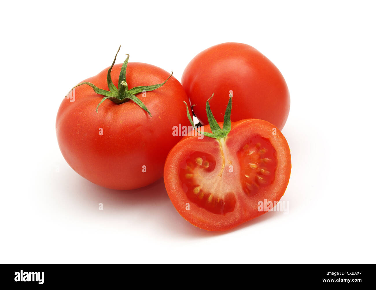 Three isolated tomatoes. Element of design Stock Photo - Alamy