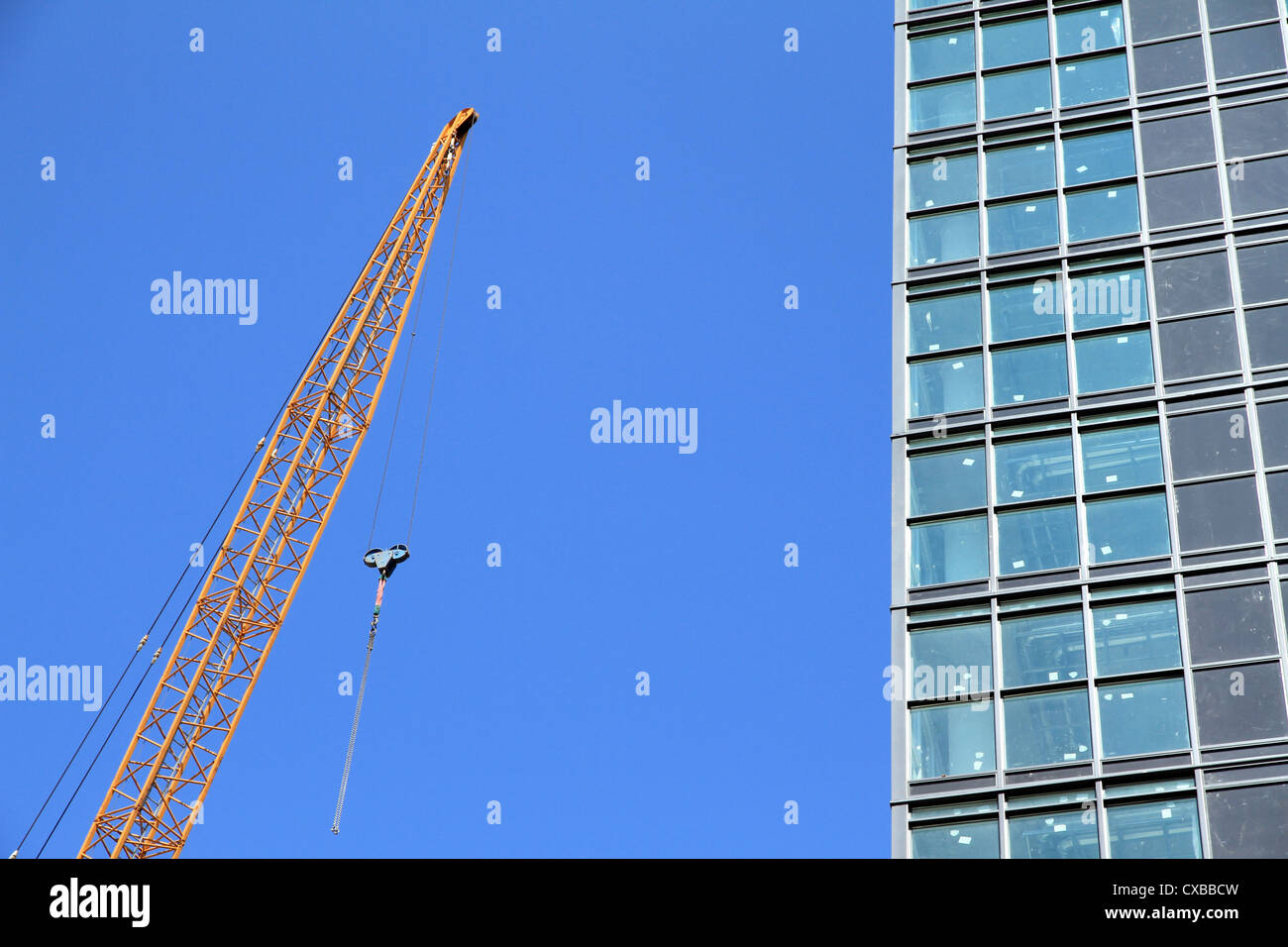 Crane and new building Stock Photo - Alamy