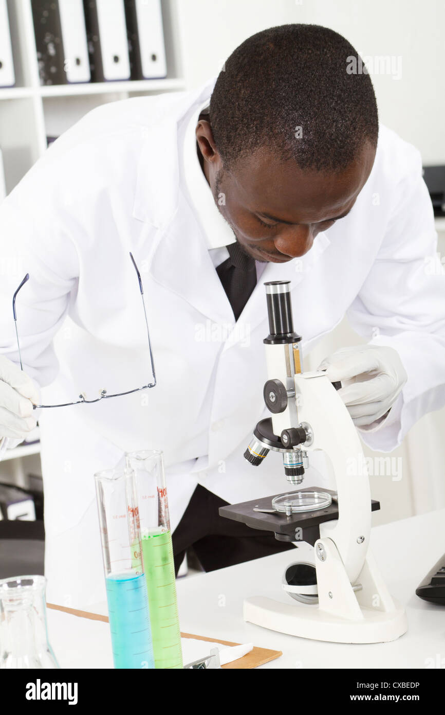 Black Man Looking Through Microscope High Resolution Stock Photography ...