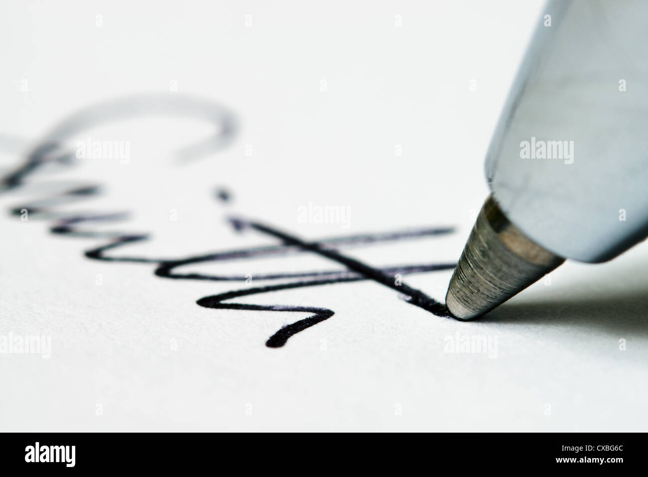Close up of ball point pen nib and text Stock Photo - Alamy
