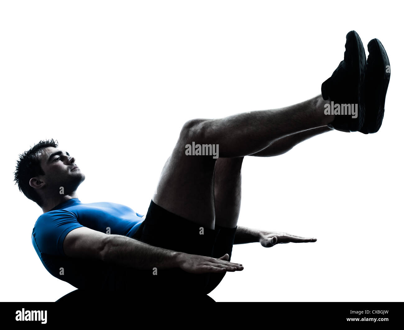 one caucasian man exercising workout fitness in silhouette studio ...