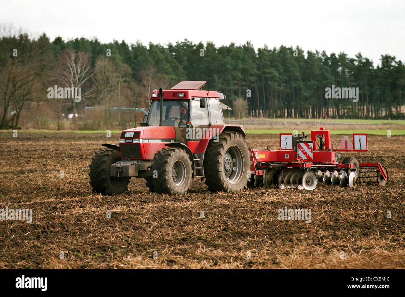 Tractor in the field, Northern Germany Stock Photo - Alamy