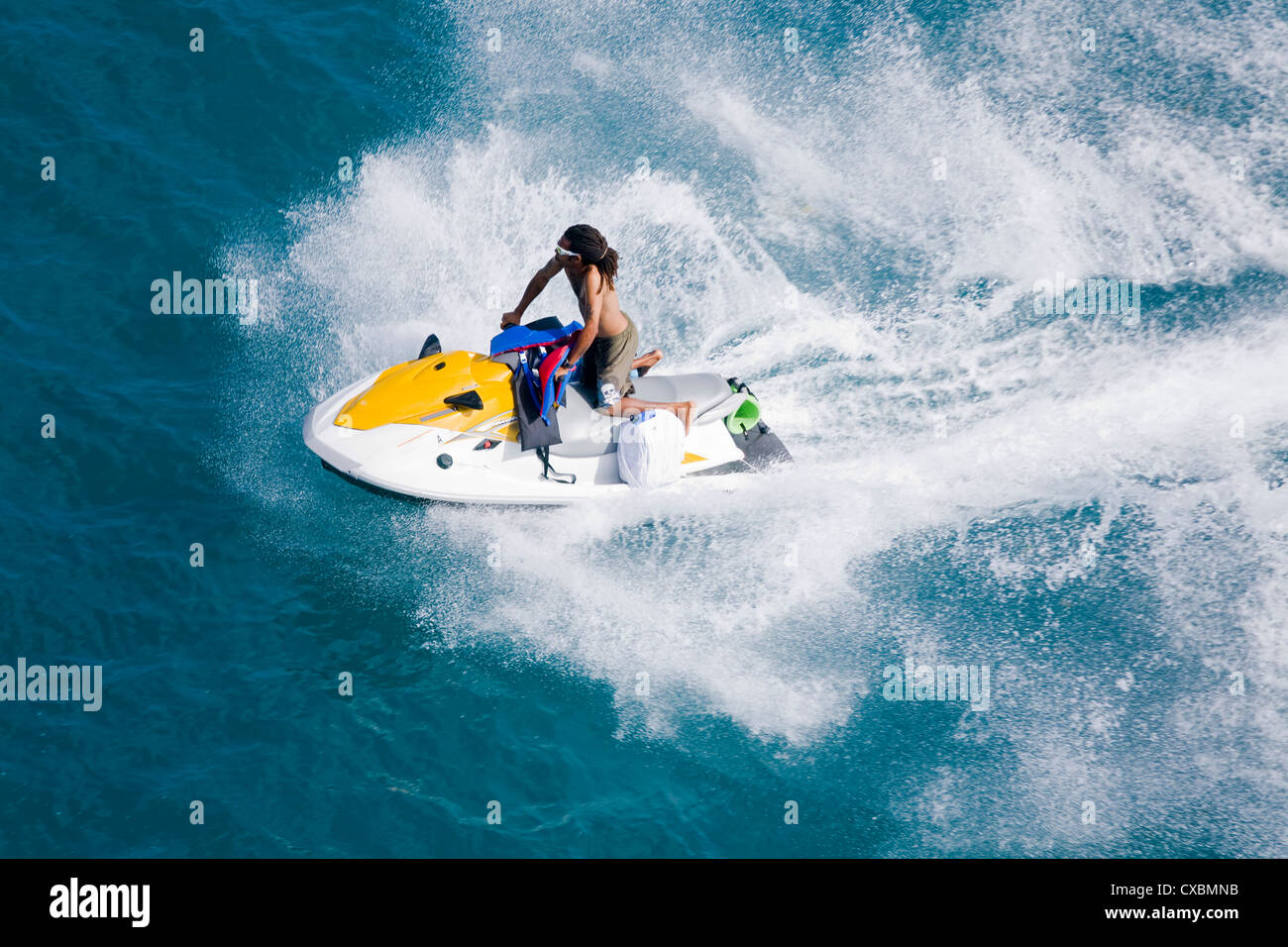 Man on a jet ski, Nassau harbor, New Providence Island, Bahamas, West ...