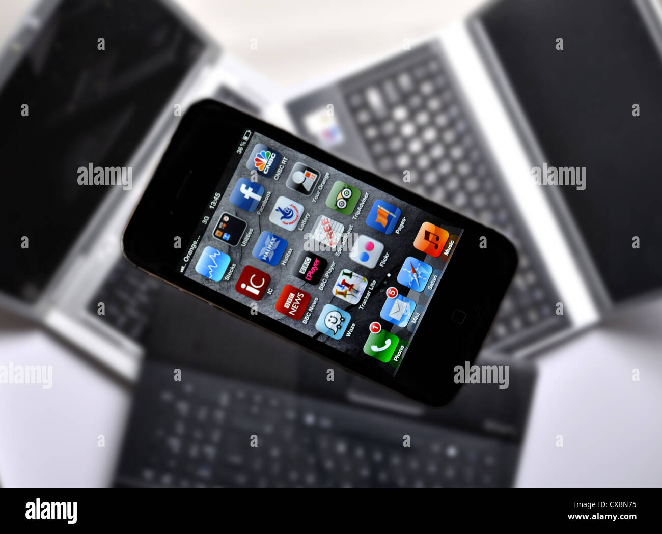 iphone with laptops in background Stock Photo - Alamy