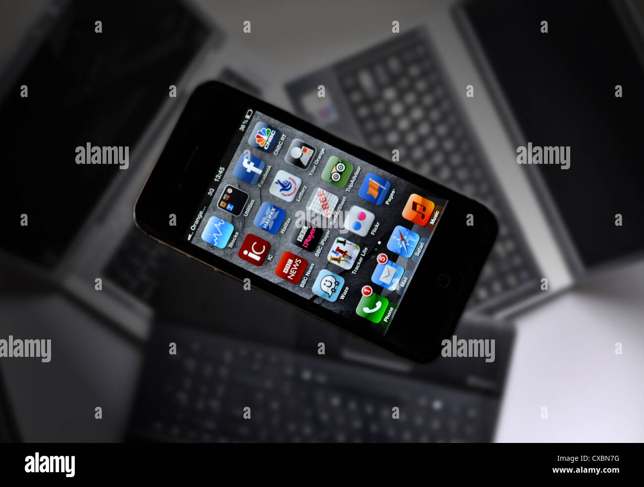 iphone with laptops in background Stock Photo - Alamy