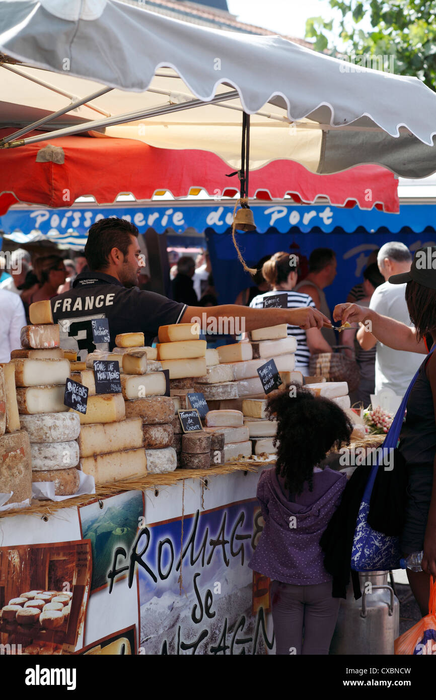 French market cheese stall with people trying samples Stock Photo - Alamy