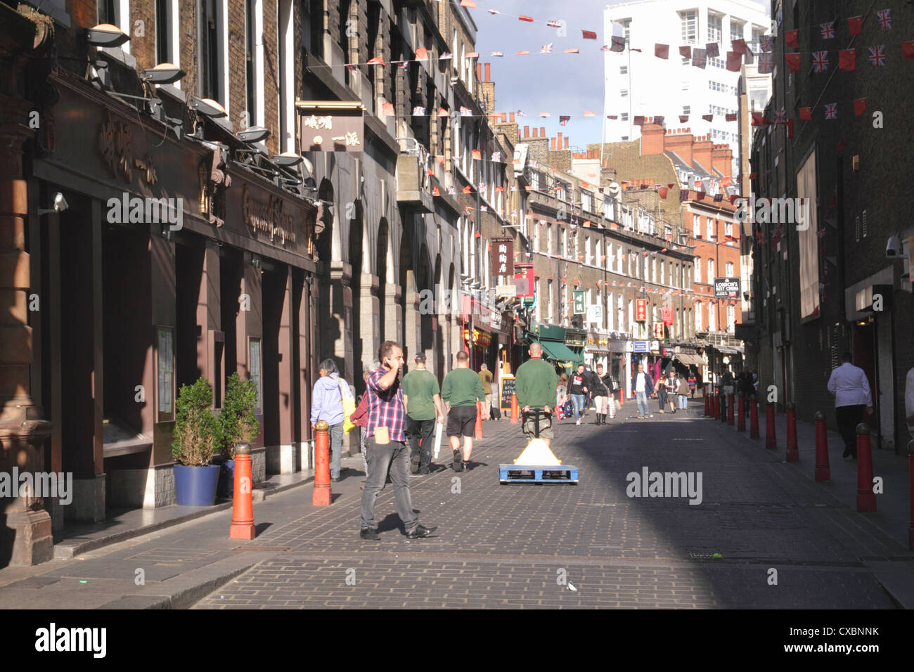Shopping in Lisle Street Chinatown Soho London Stock Photo - Alamy