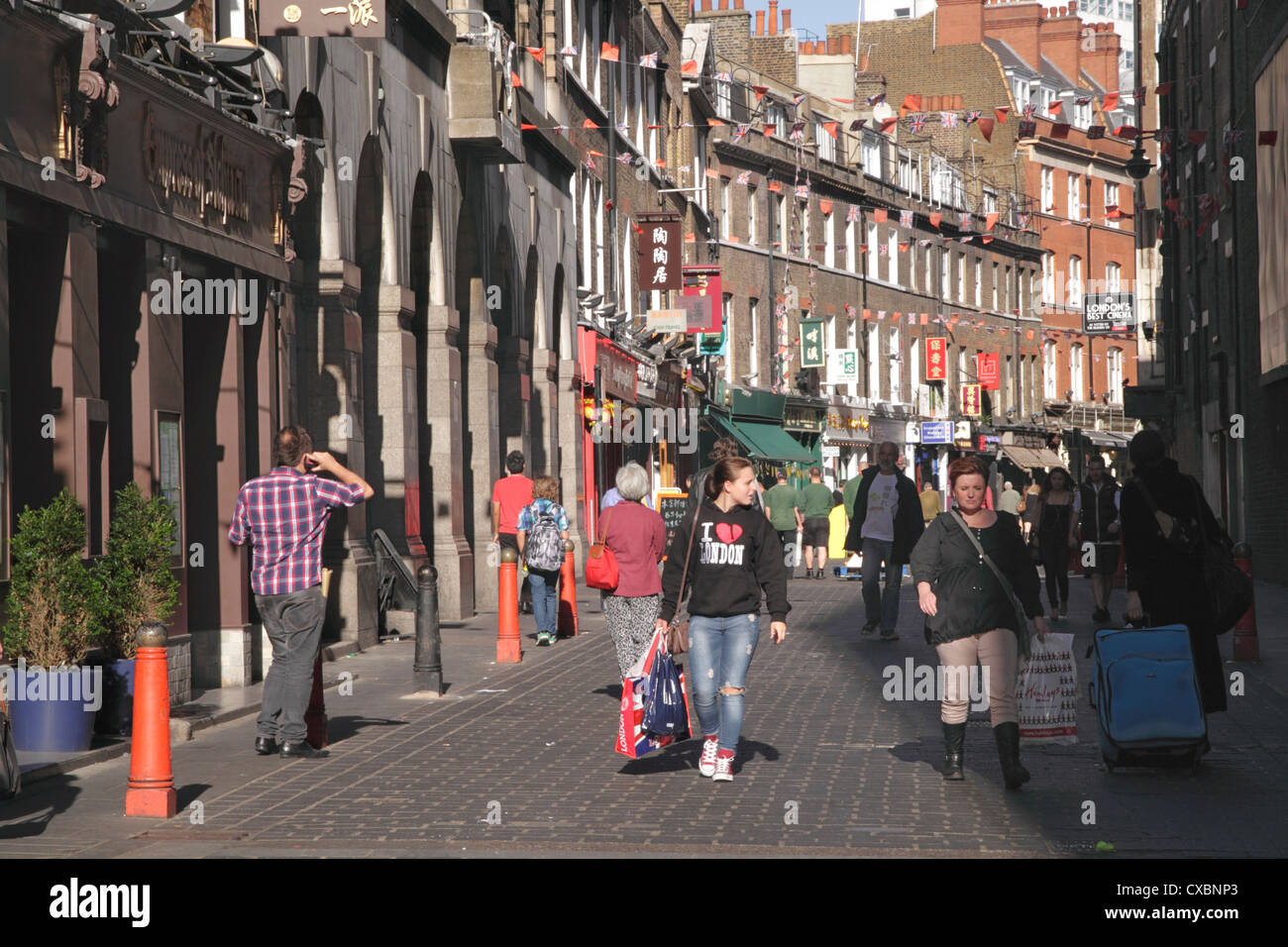 Shopping in Lisle Street Chinatown Soho London Stock Photo - Alamy