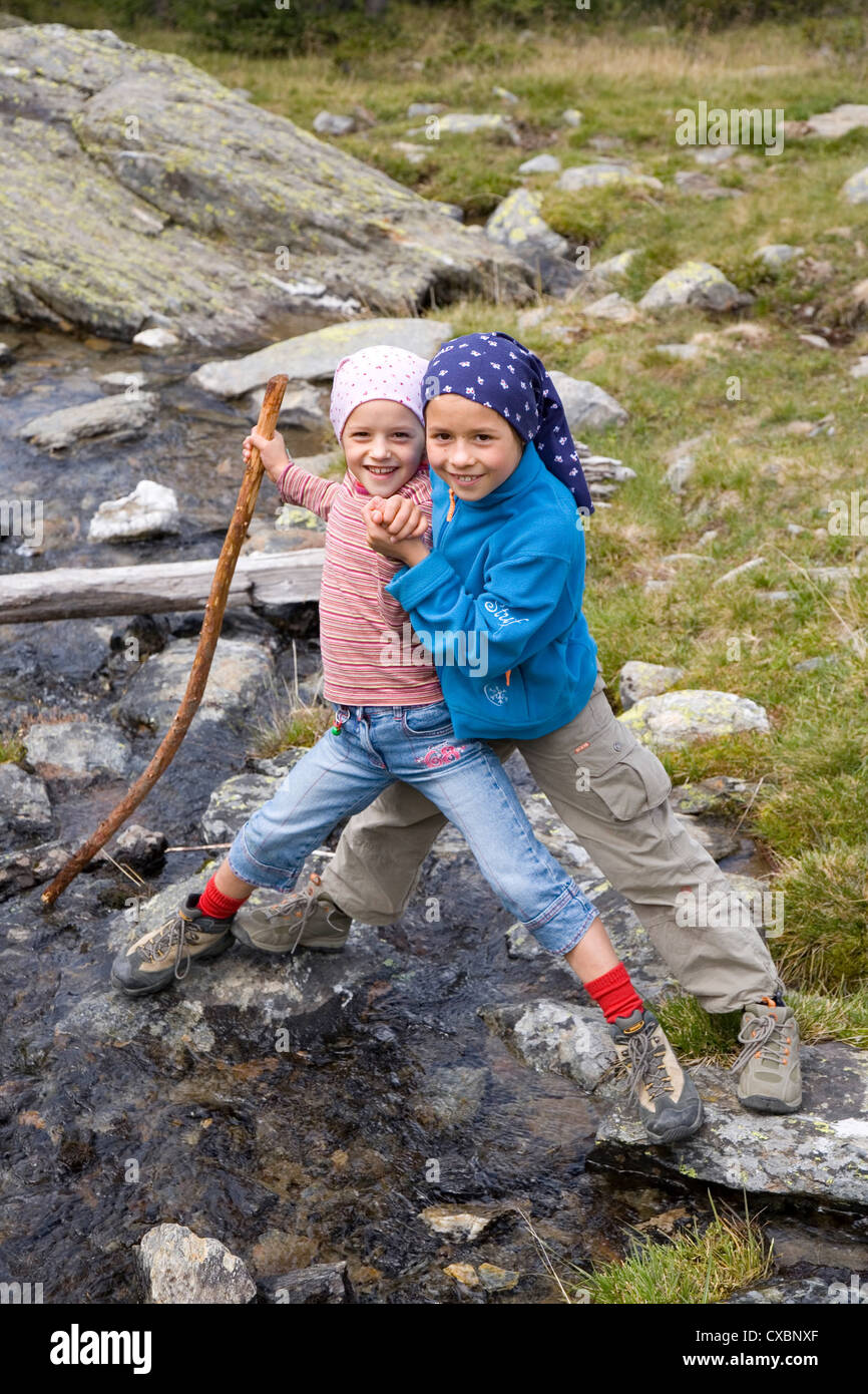 Italy, children playing on a creek near Laces Stock Photo - Alamy