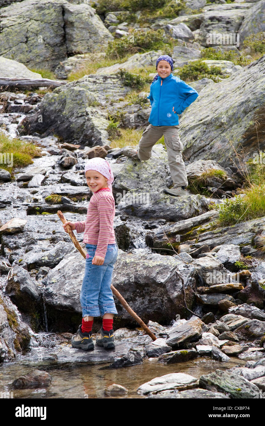 Italy, children playing on a creek near Laces Stock Photo - Alamy