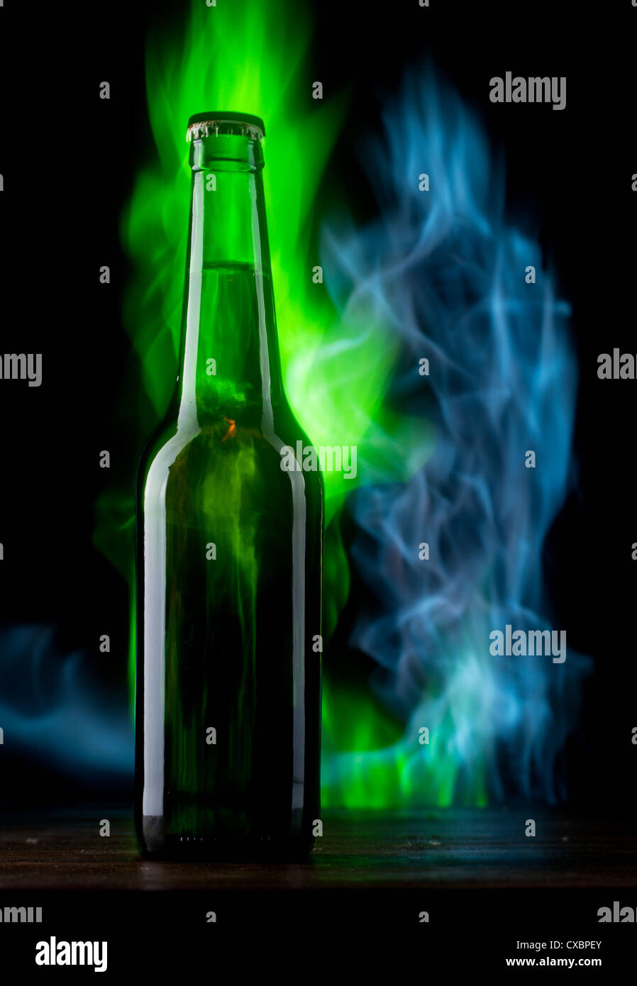 Beer bottle with color fire Stock Photo - Alamy