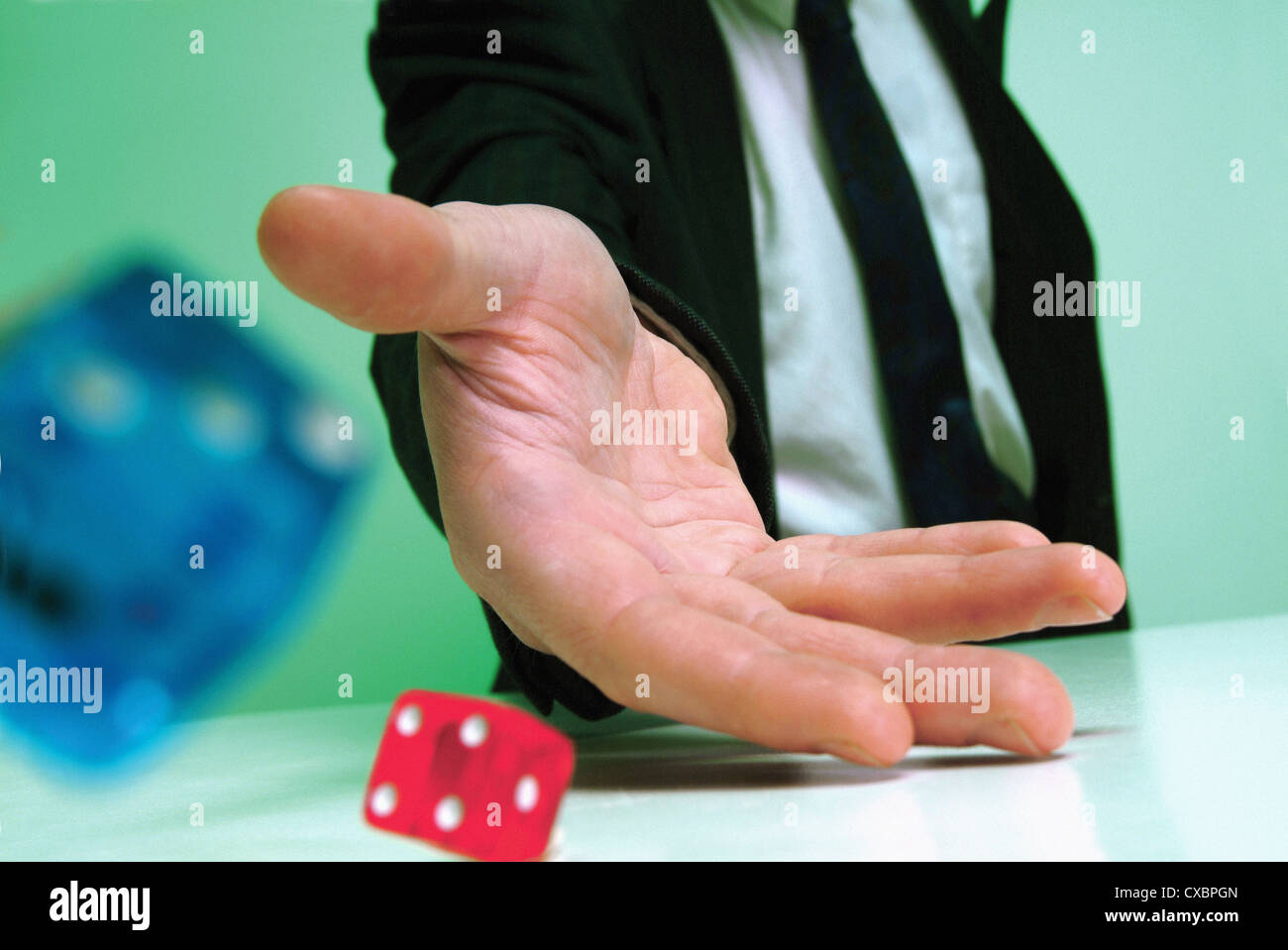 Man rolling dice hi-res stock photography and images - Alamy
