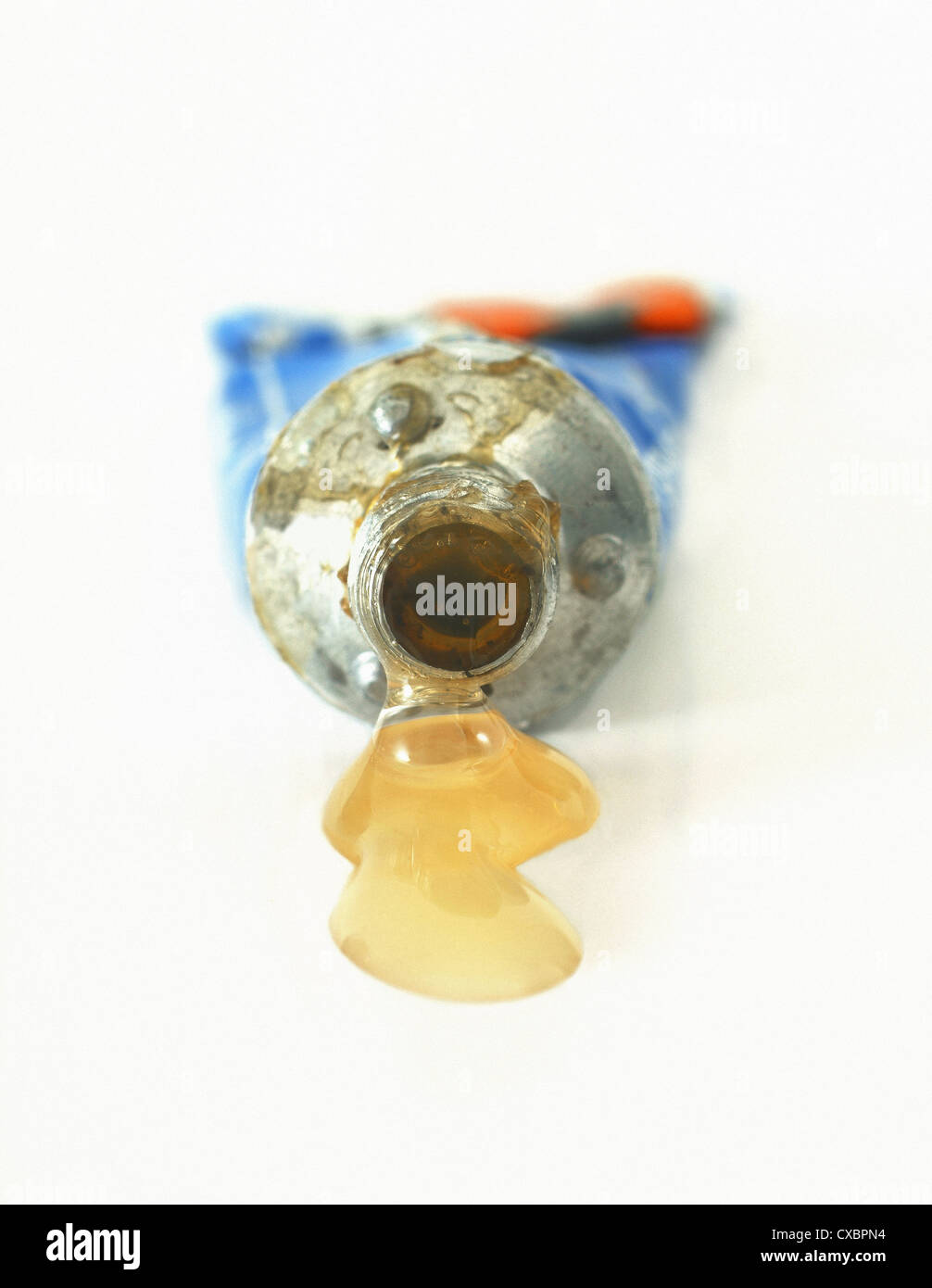 close-up of glue leaking from tube Stock Photo - Alamy