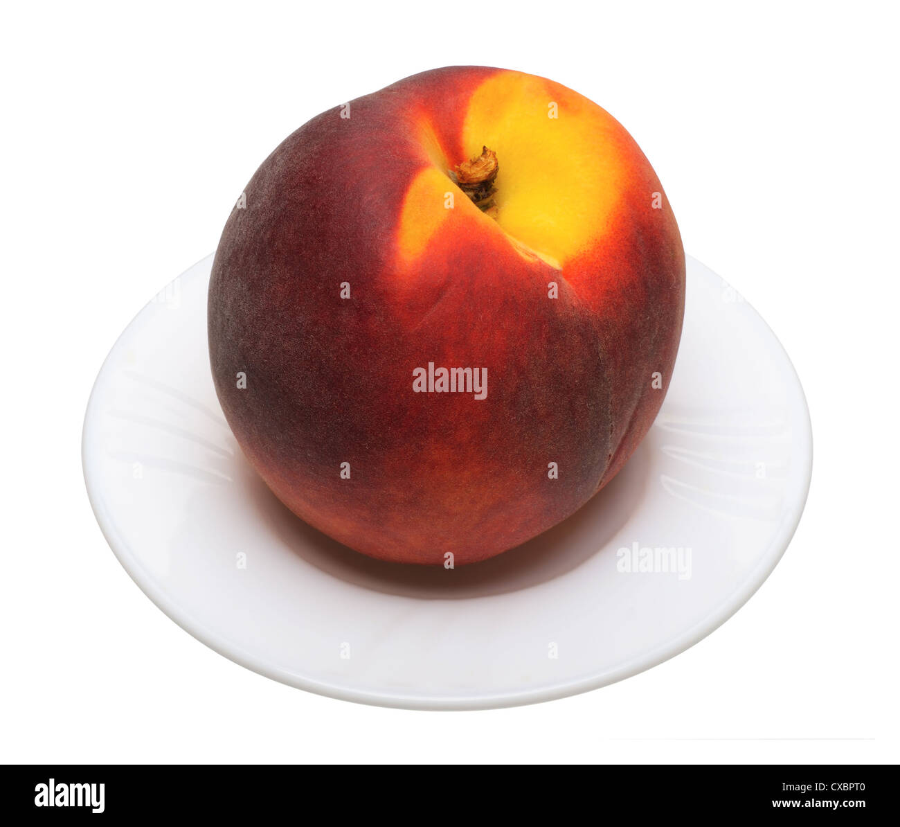 Ripe peach on a plate on a white background, isolated Stock Photo - Alamy