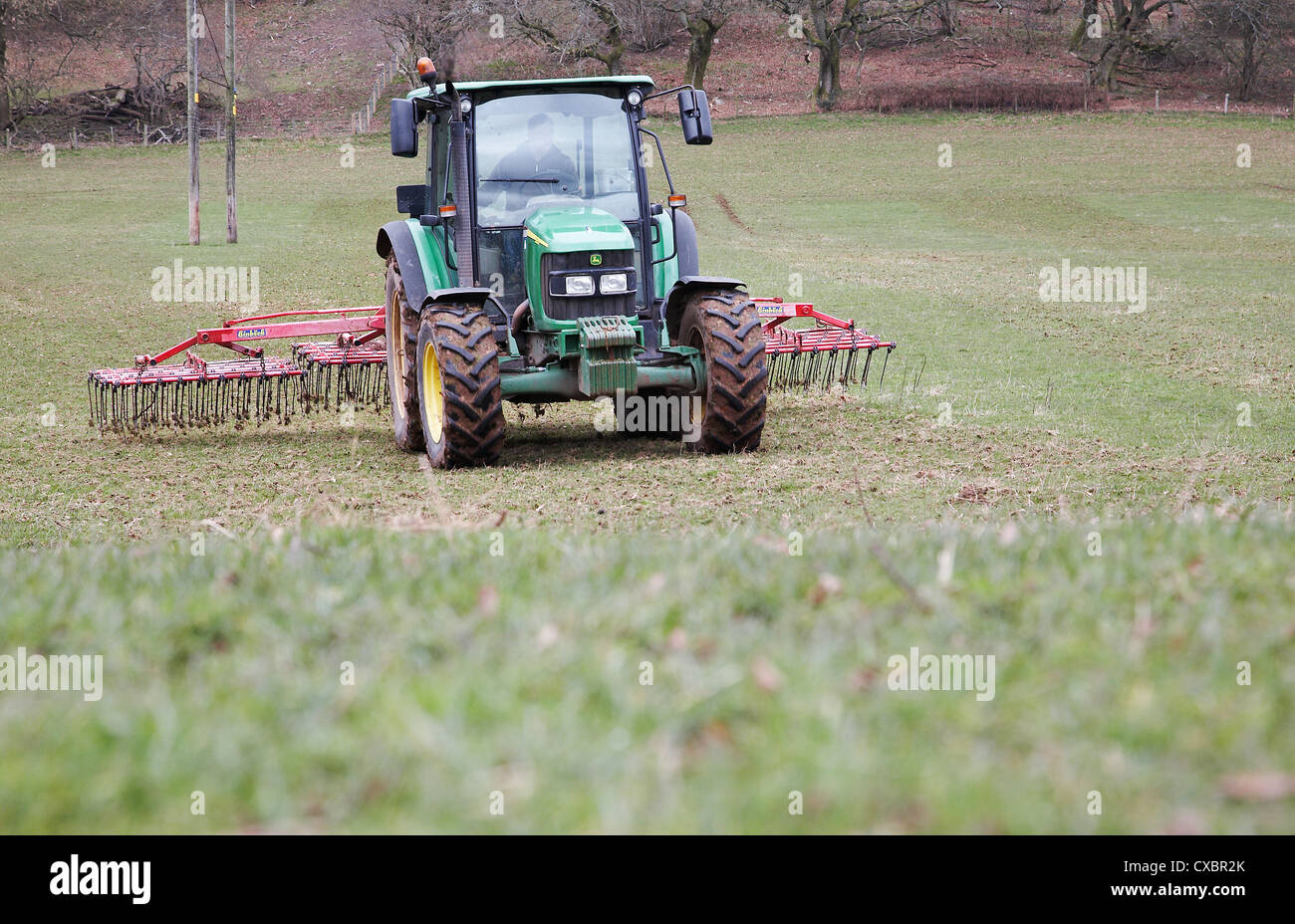 Farmer in tractor aerating field hi-res stock photography and images ...