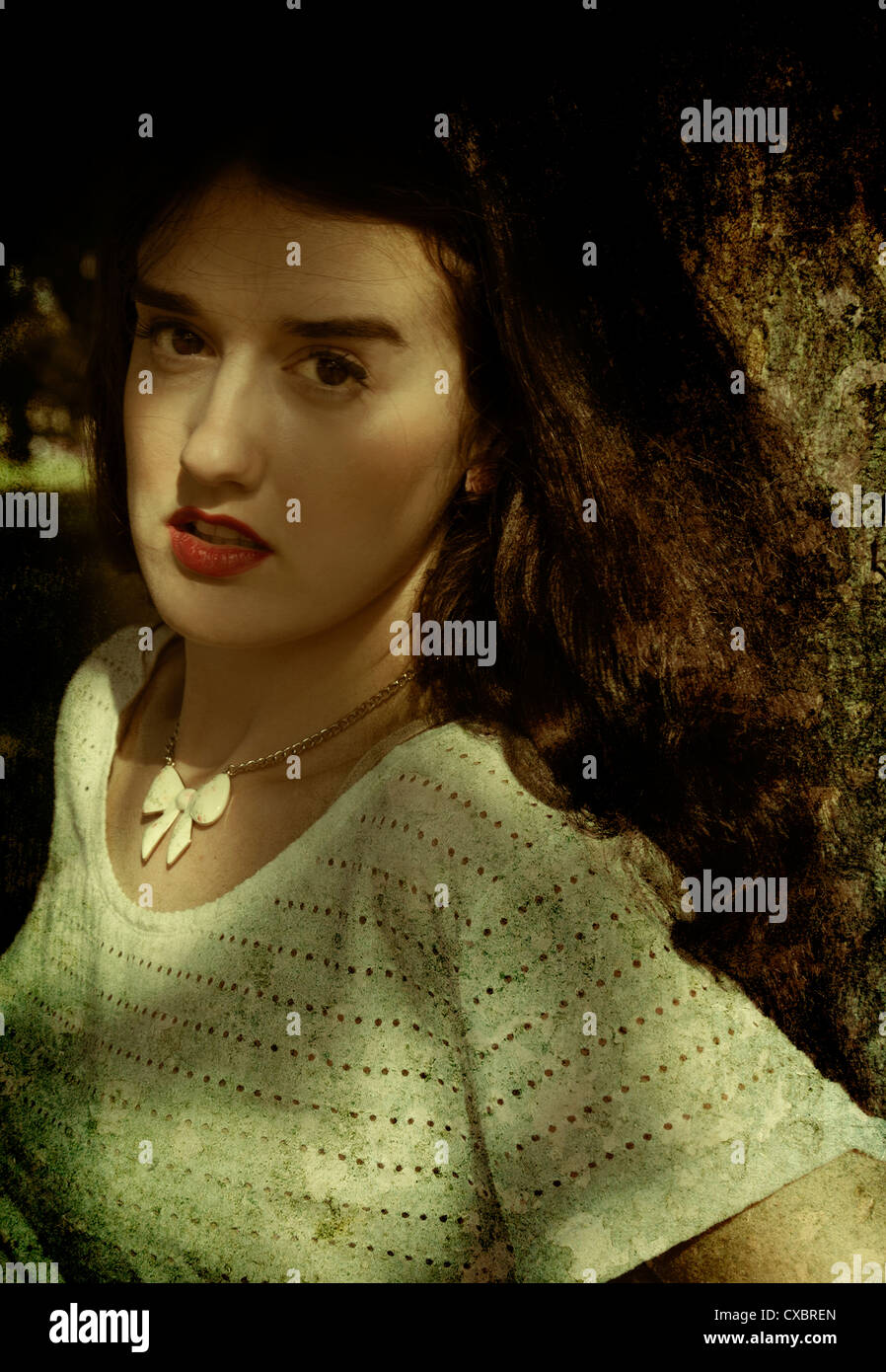 Woman Against Tree with an Afraid look Stock Photo - Alamy