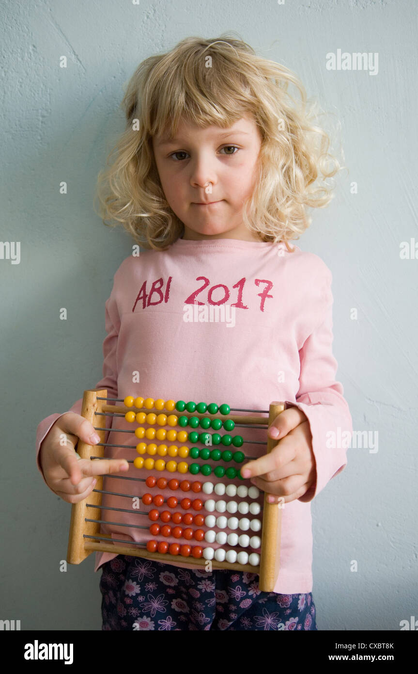 Child with slide rule, Berlin Stock Photo - Alamy