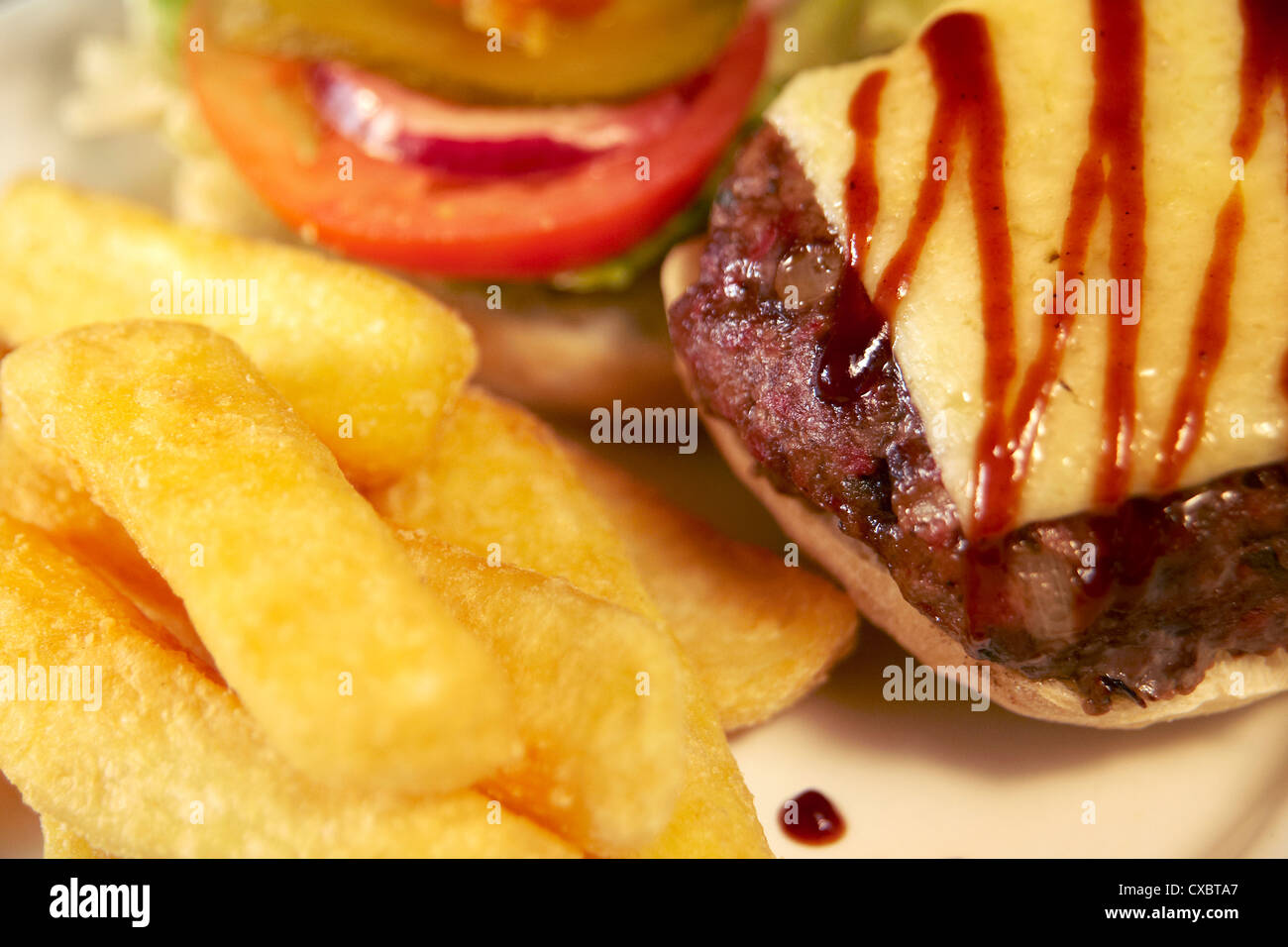 classic burger and fries with salad garnish Stock Photo - Alamy