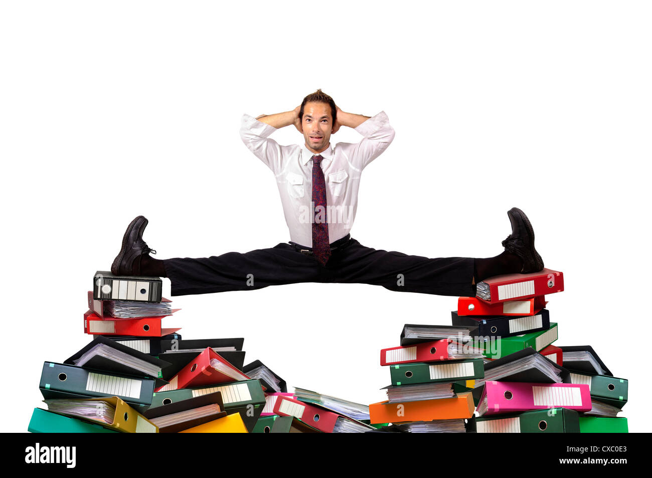 Stressed businessman doing splits over stack of files Stock Photo - Alamy