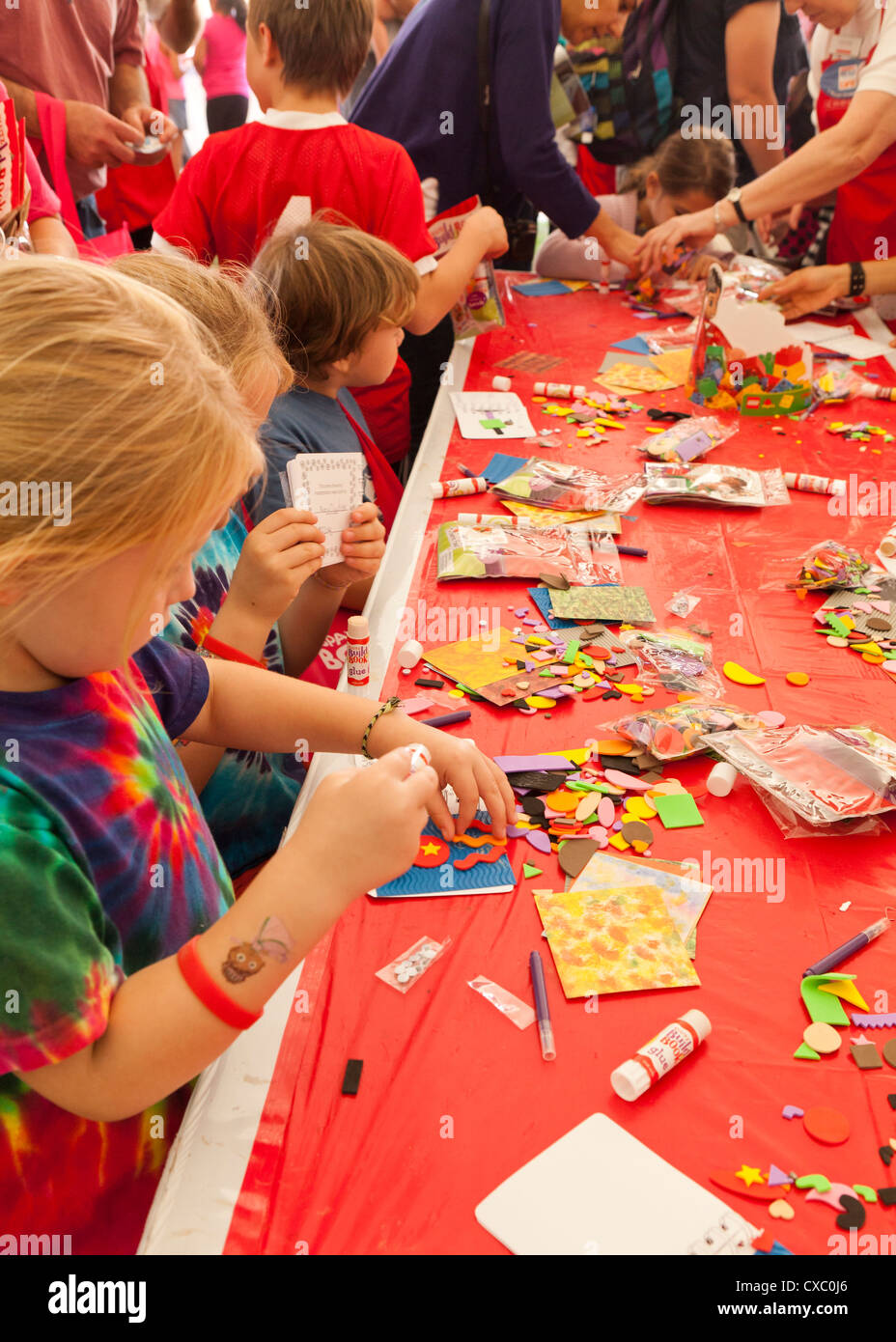 Children playing on an arts and crafts table - USA Stock Photo - Alamy
