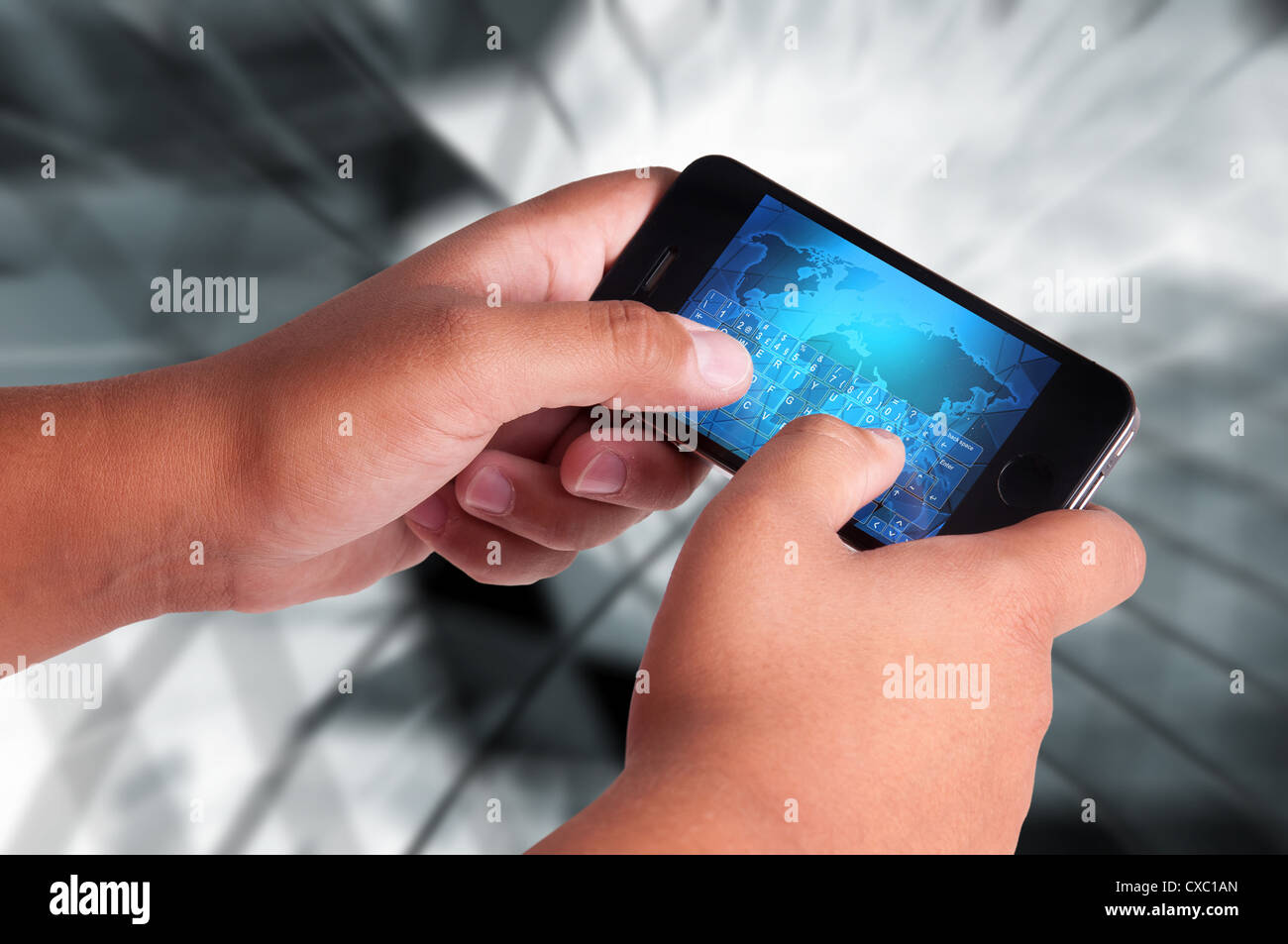 Detail of hands playing with a cellphone Stock Photo - Alamy