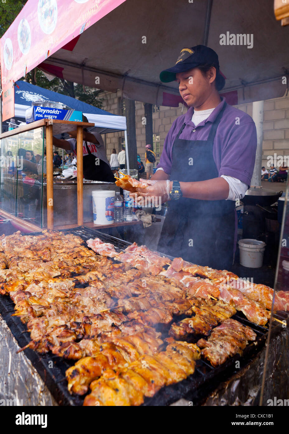 Man cooking chicken skewers kebabs hi-res stock photography and images ...