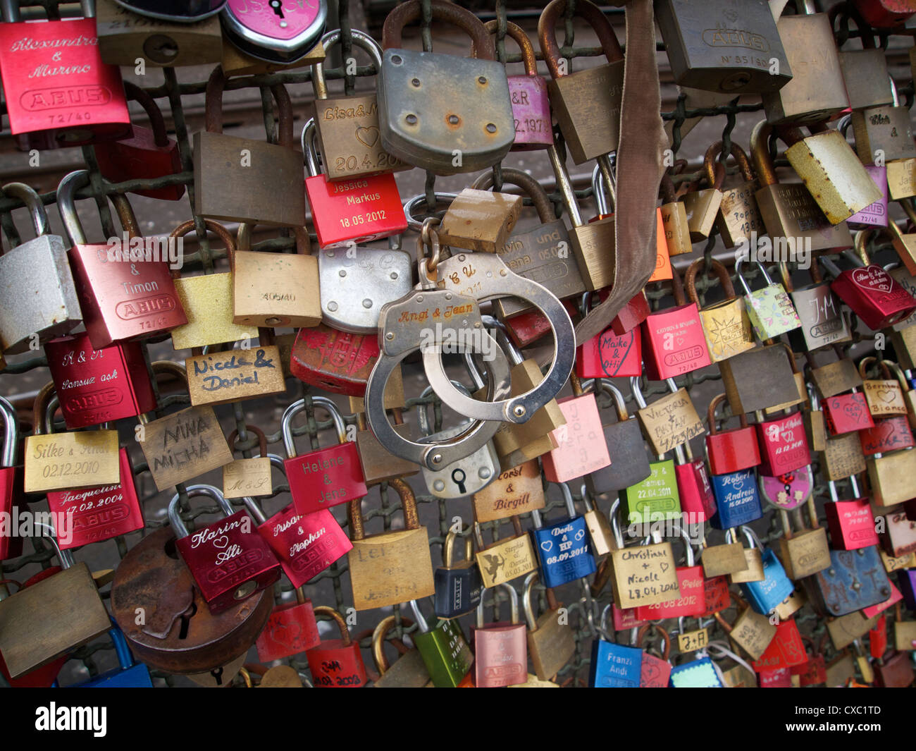 Padlocks and handcuffs symbolizing relationships on the ...