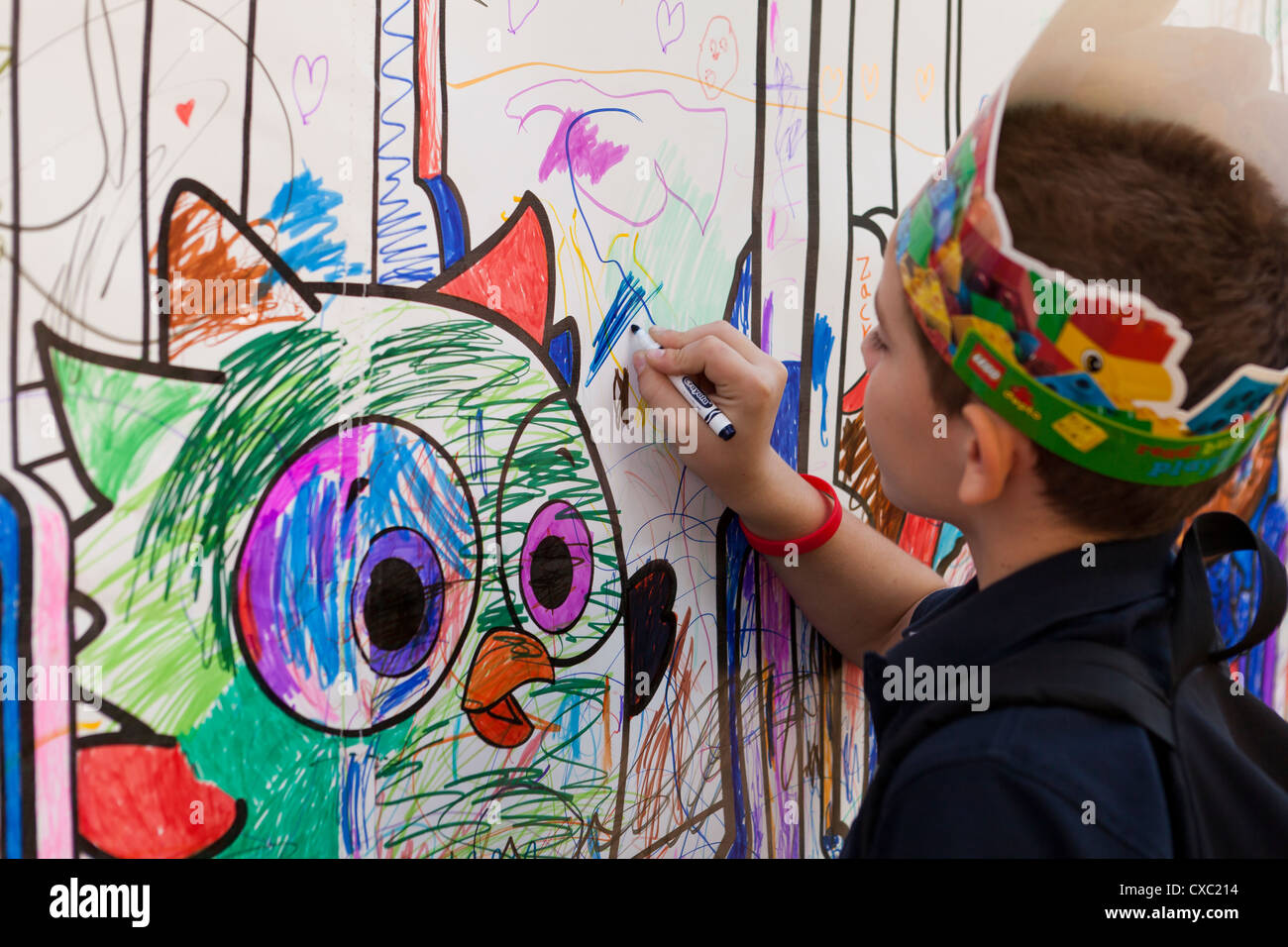 Boy coloring with marker - USA Stock Photo - Alamy