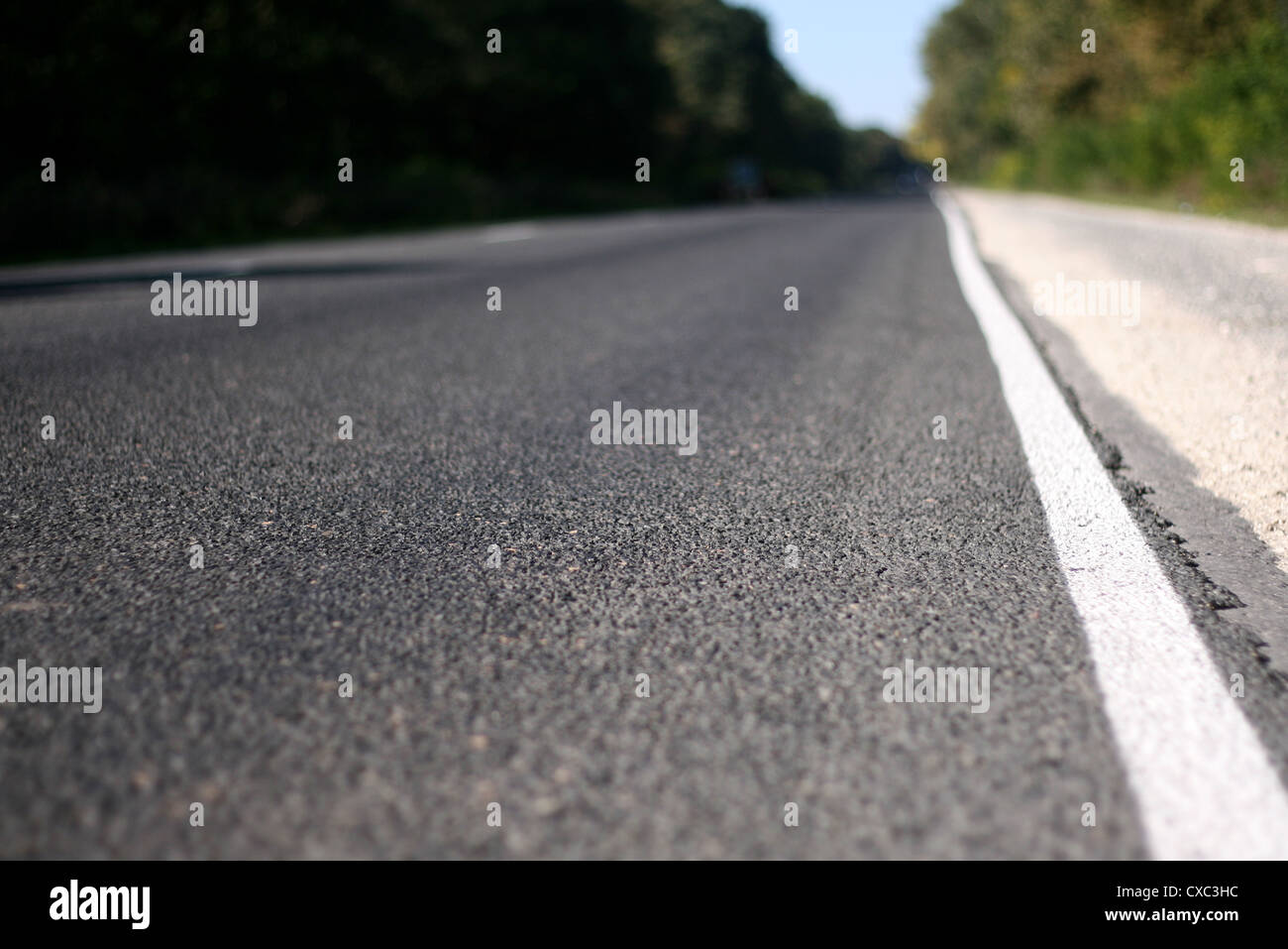 Asphalt road, shot with low depth of field Stock Photo - Alamy