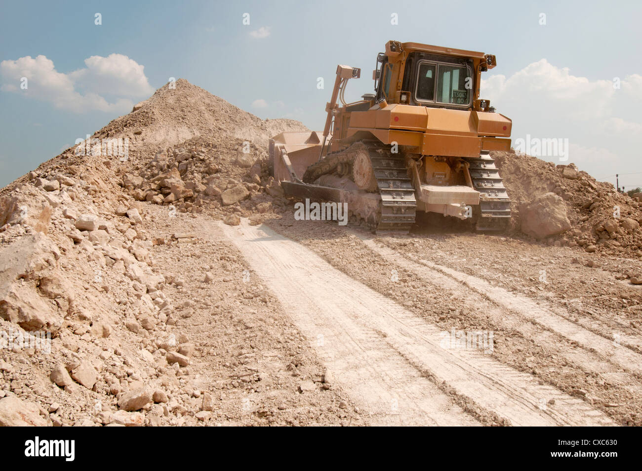 loading machine produces crushed stone for a career Stock Photo - Alamy