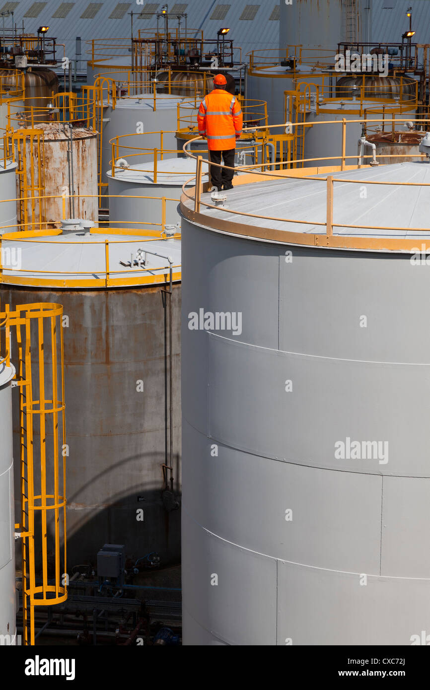 chemical plant process operator in petro-chemical industry checking ...