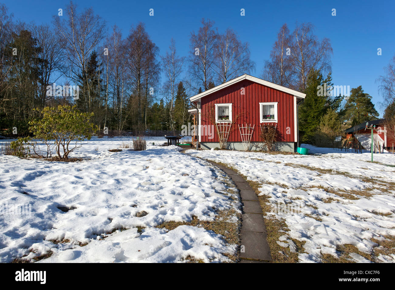 Red cottage in early spring in Sweden. Property release available Stock ...